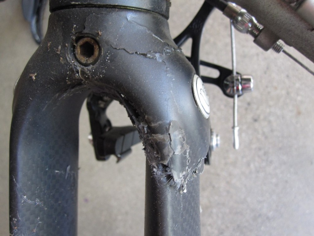Why forks often break on road bikes and what is the solution?